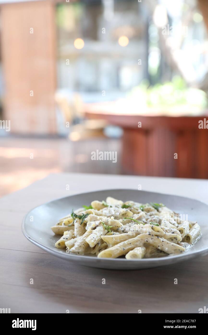 Penne pasta with white sauce and truffle , italian food Stock Photo - Alamy