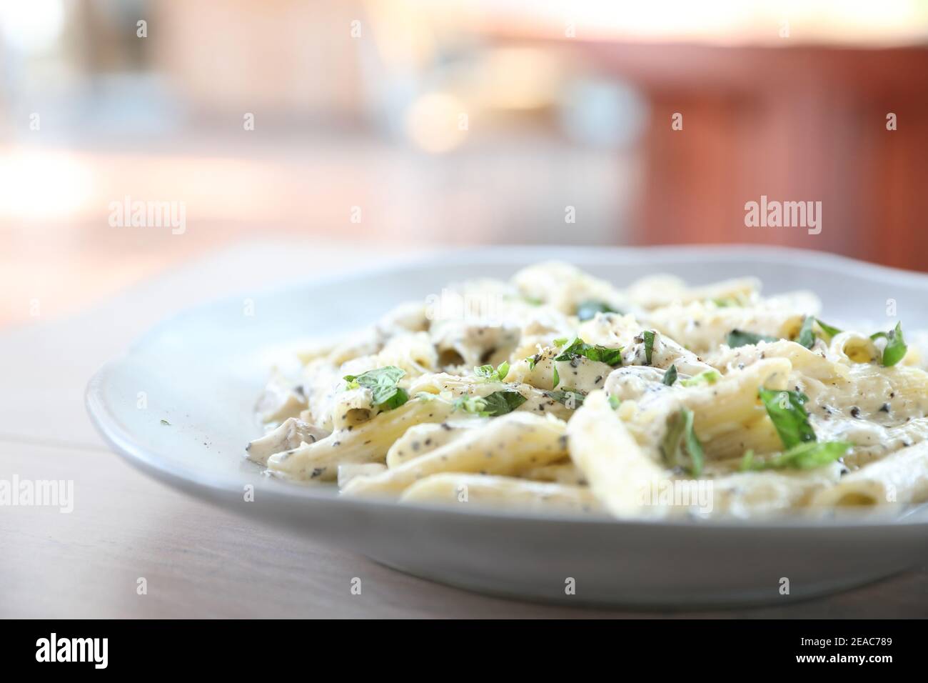 Penne pasta with white sauce and truffle , italian food Stock Photo - Alamy