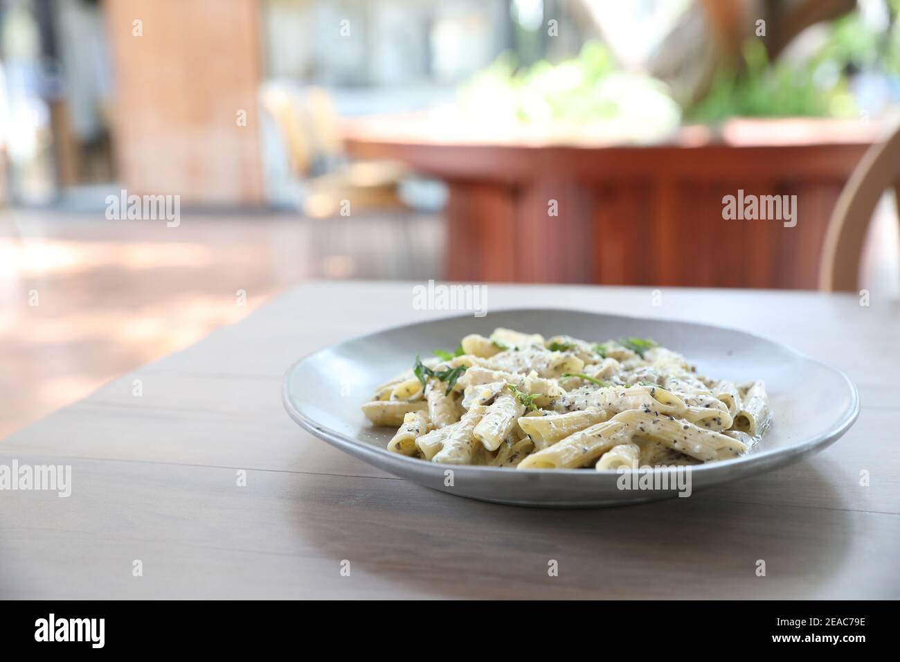 Penne pasta with white sauce and truffle , italian food Stock Photo - Alamy