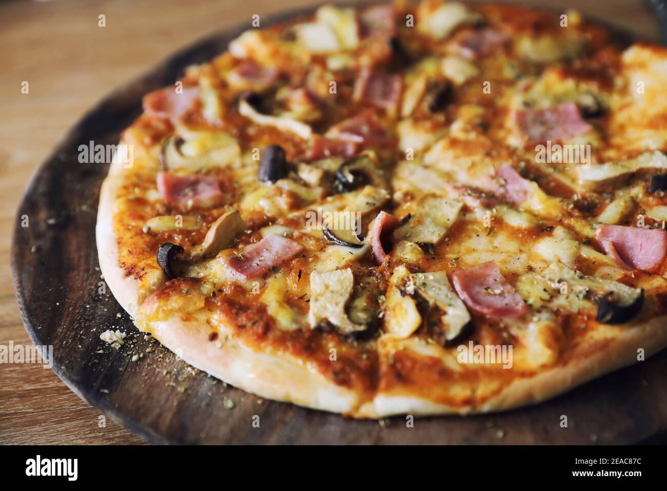 pizza ham and mushroom on wood background Stock Photo - Alamy