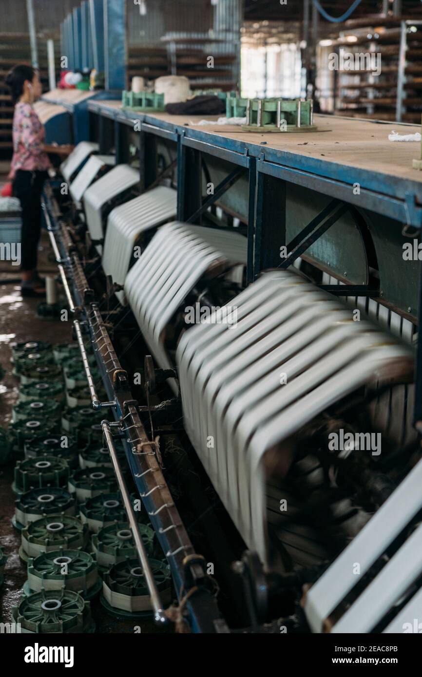 Electric silk factory machines spinning in Vietnam Stock Photo - Alamy