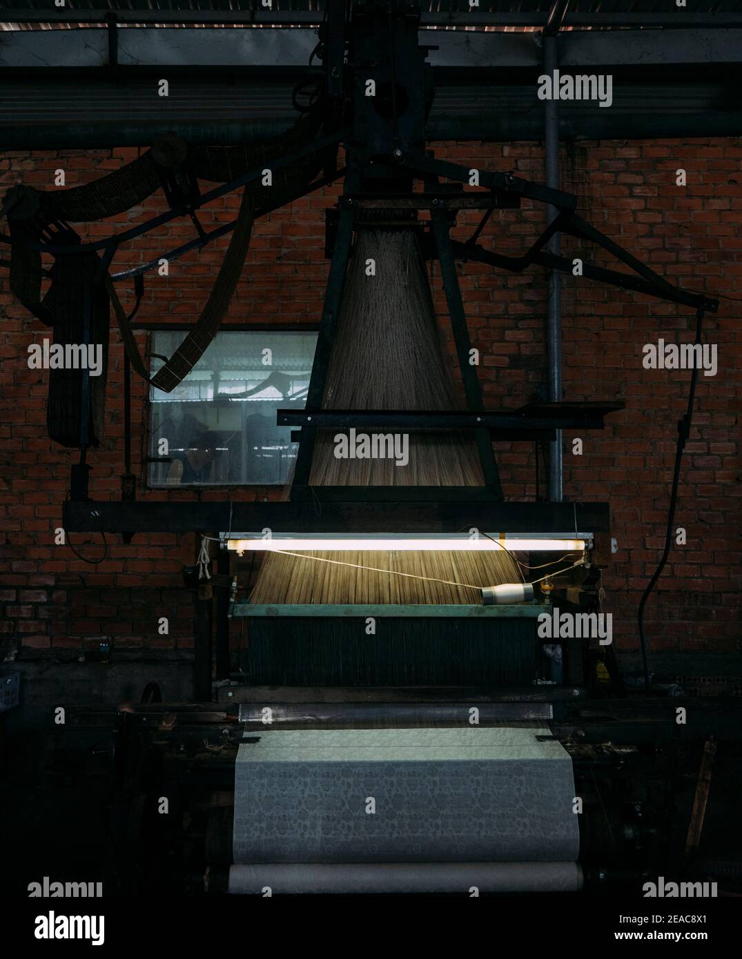 Old silk weaving machine running, creating silk cloth Stock Photo - Alamy