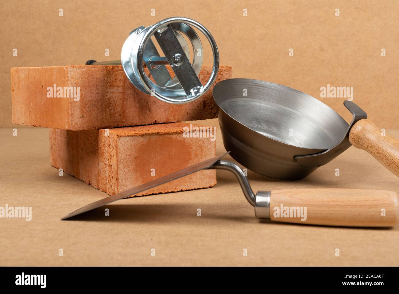 Picture of brick and mason tools on wooden background, top view Stock ...