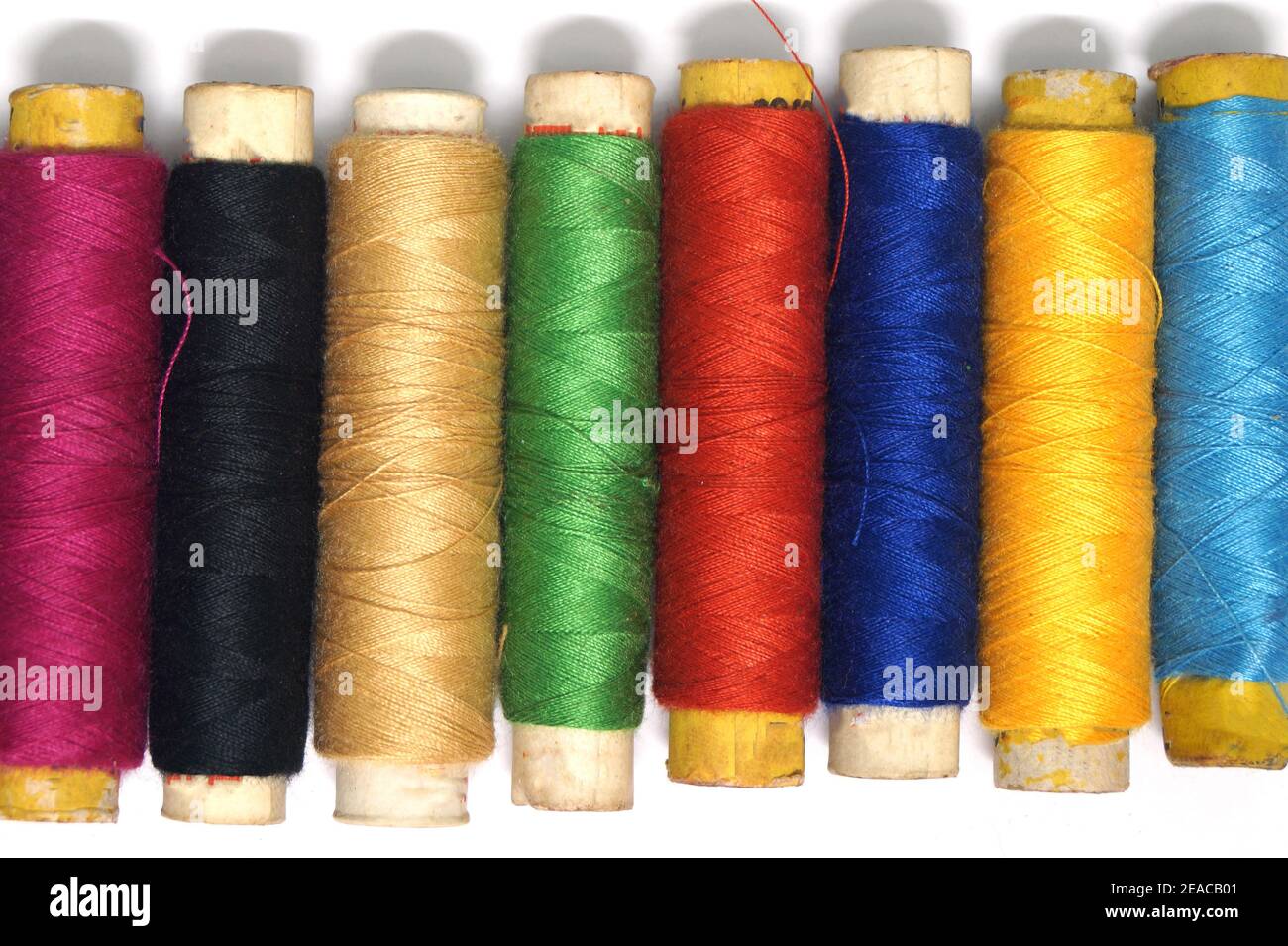 Group of threads in a white background Stock Photo - Alamy