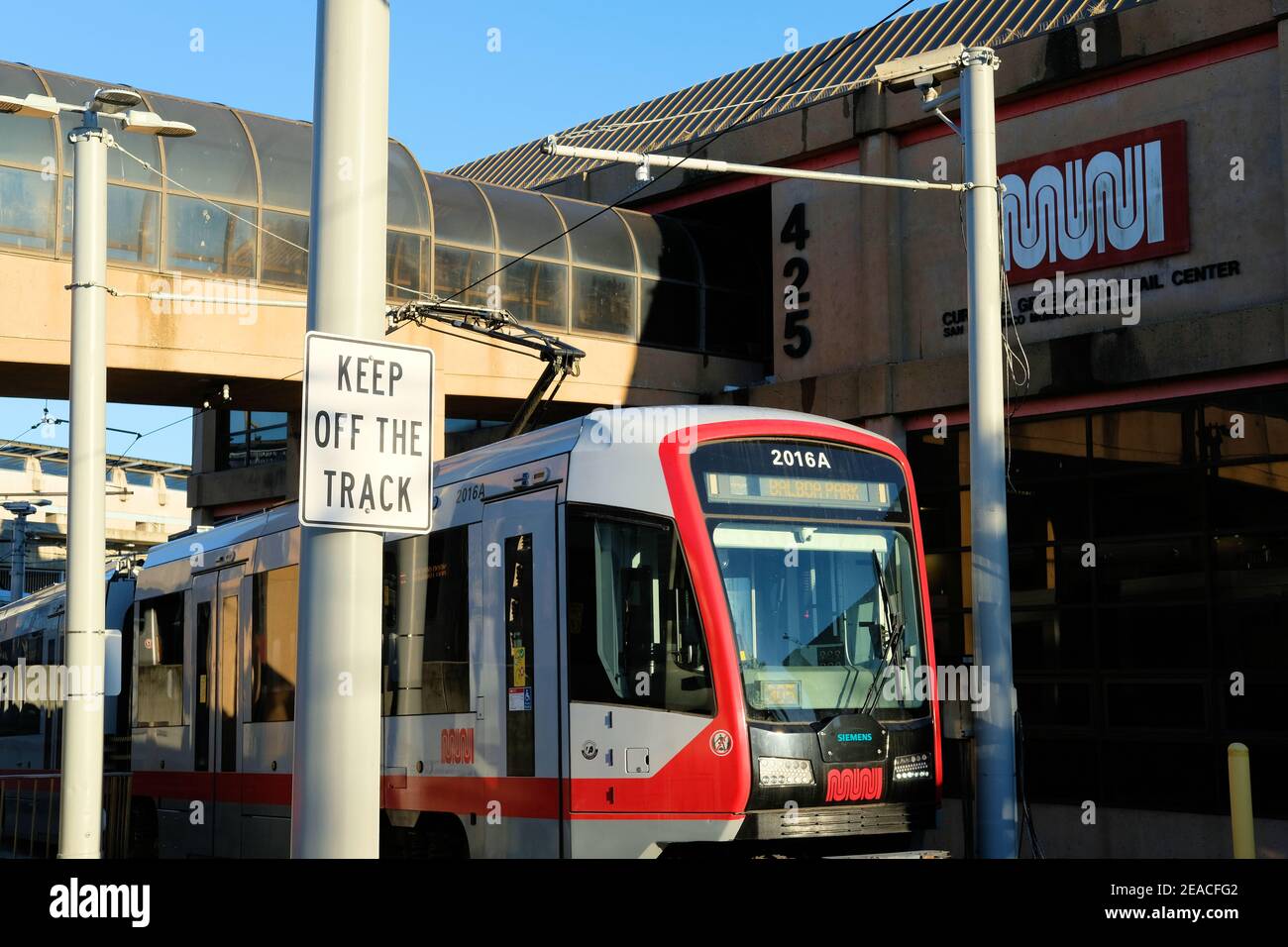 Keep off the track sign in front of a BART metro train car in San ...