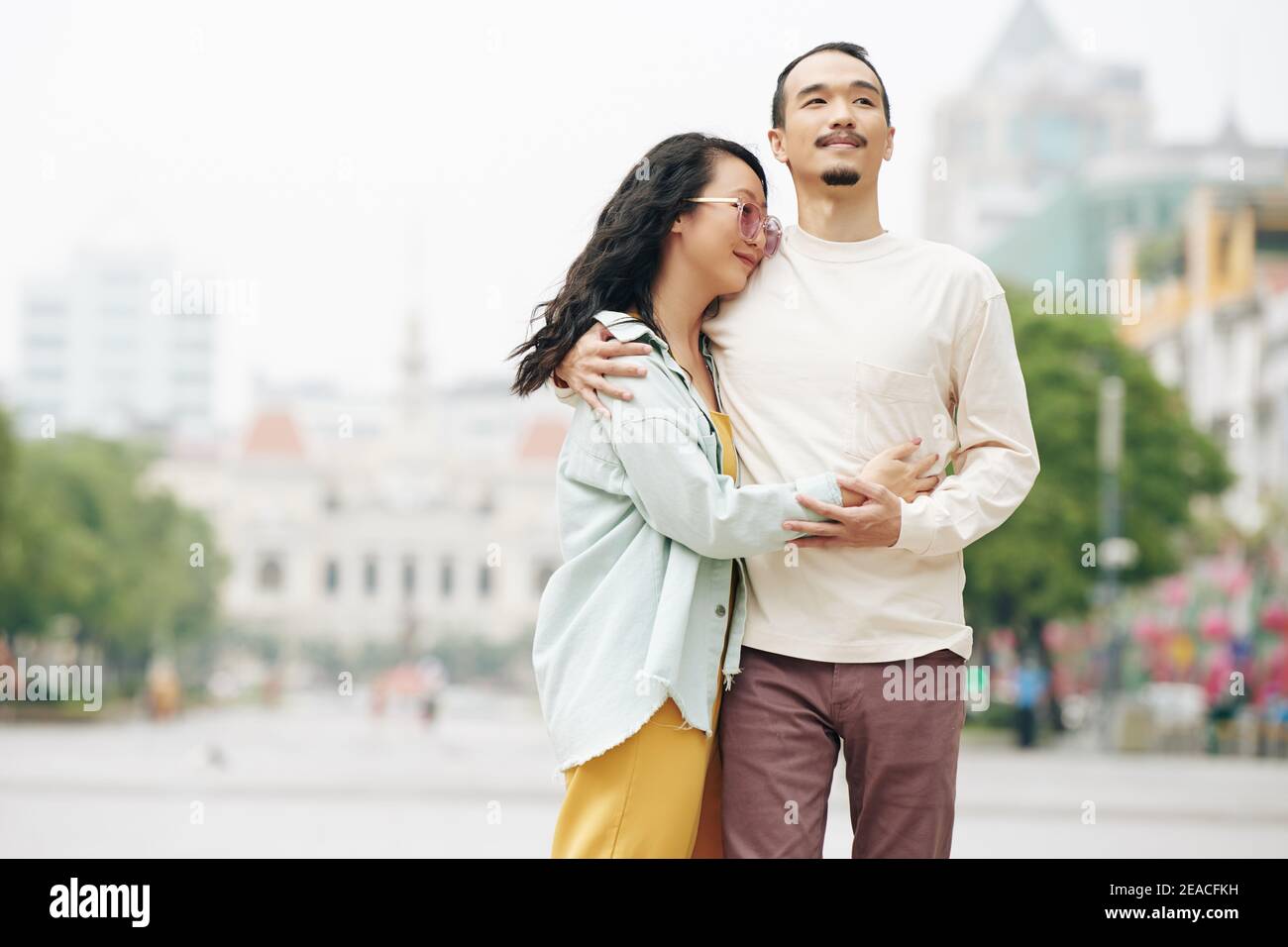 Woman in love hugging boyfriend Stock Photo - Alamy