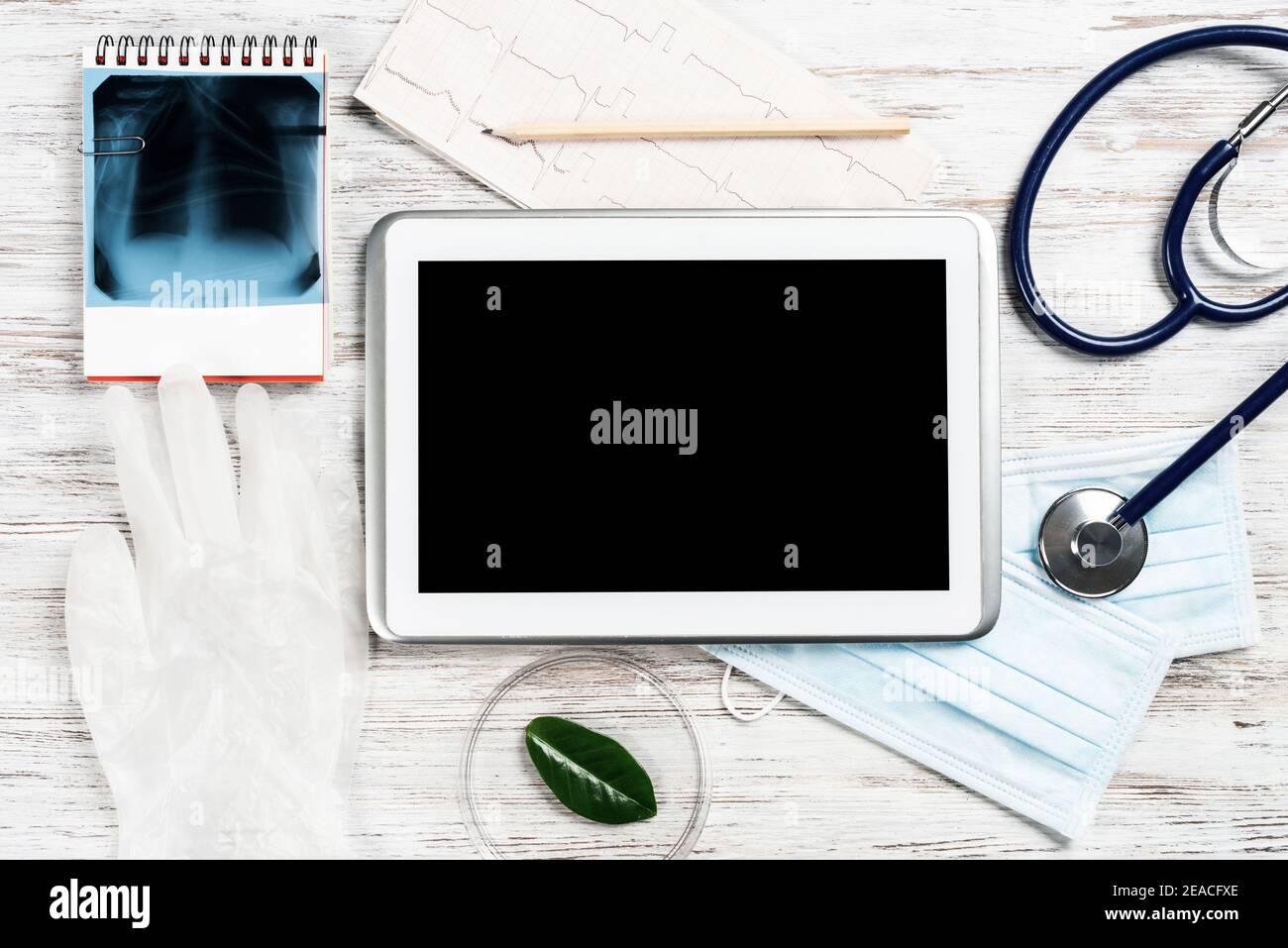 Mock up of doctors desktop with medical supplies Stock Photo - Alamy