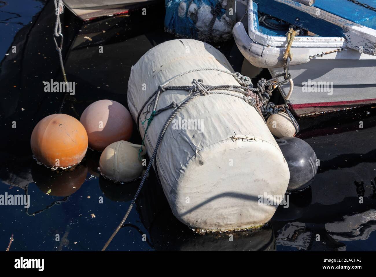 Plastic float-some and rubber buoys, in various sizes and colors, as ...