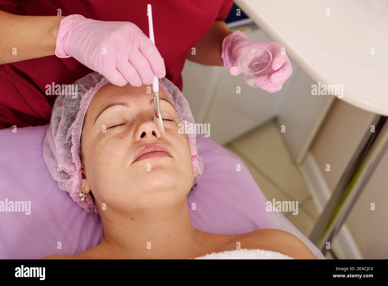 Face peeling mask, spa beauty treatment, skincare. Woman getting facial ...