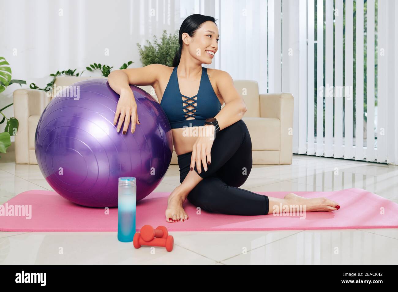 Woman exercising at home Stock Photo - Alamy