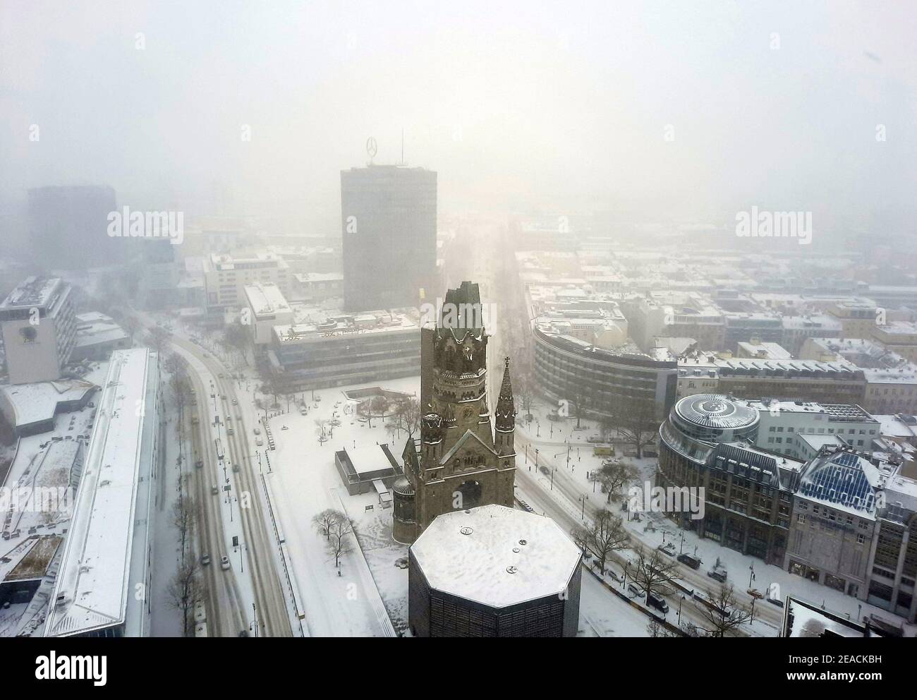 Berlin, Germany. 08th Feb, 2021. Snow lies around the Kaiser Wilhelm ...