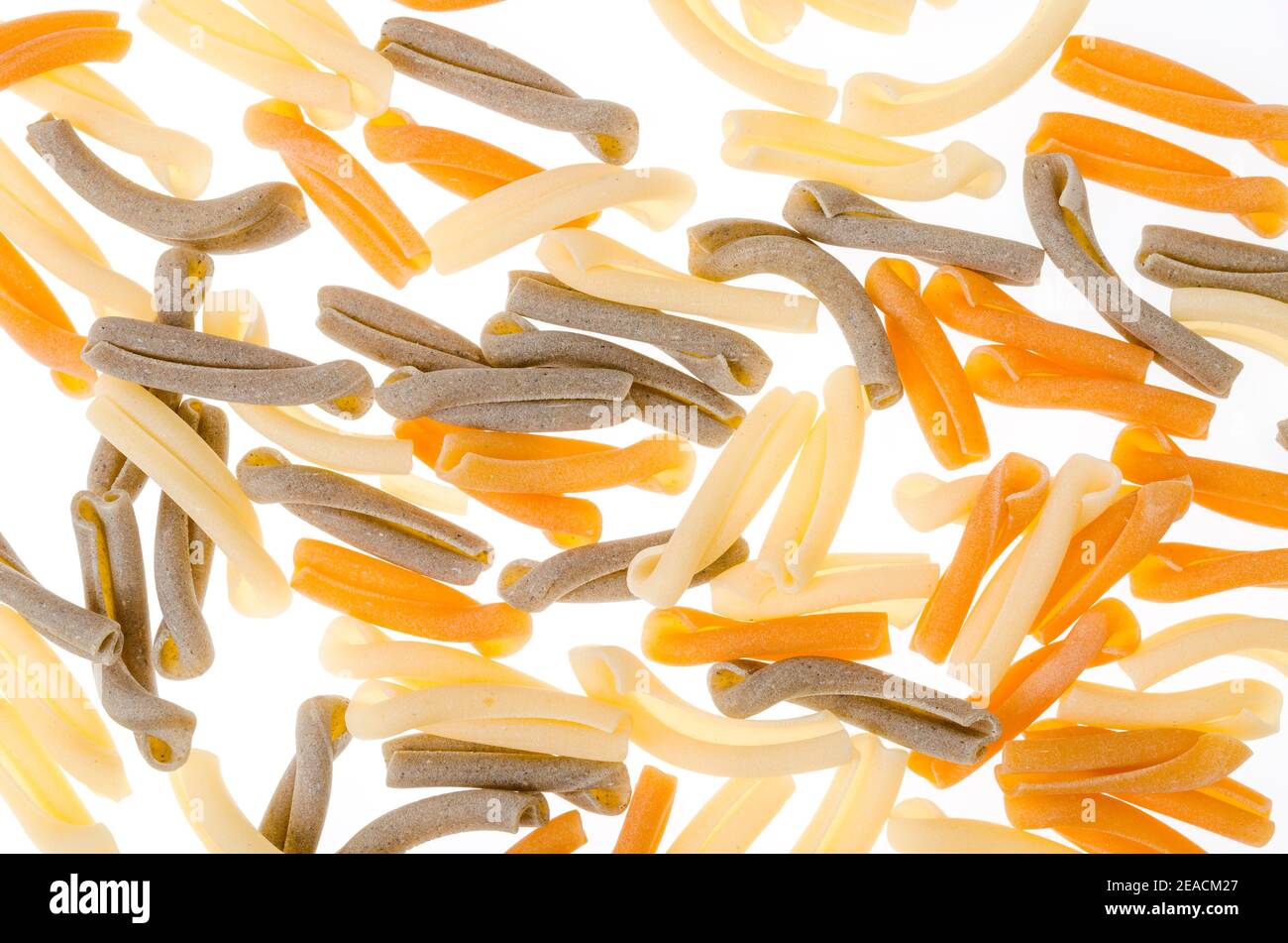 Pile of multi-colored pasta isolated on white background. Studio Photo ...