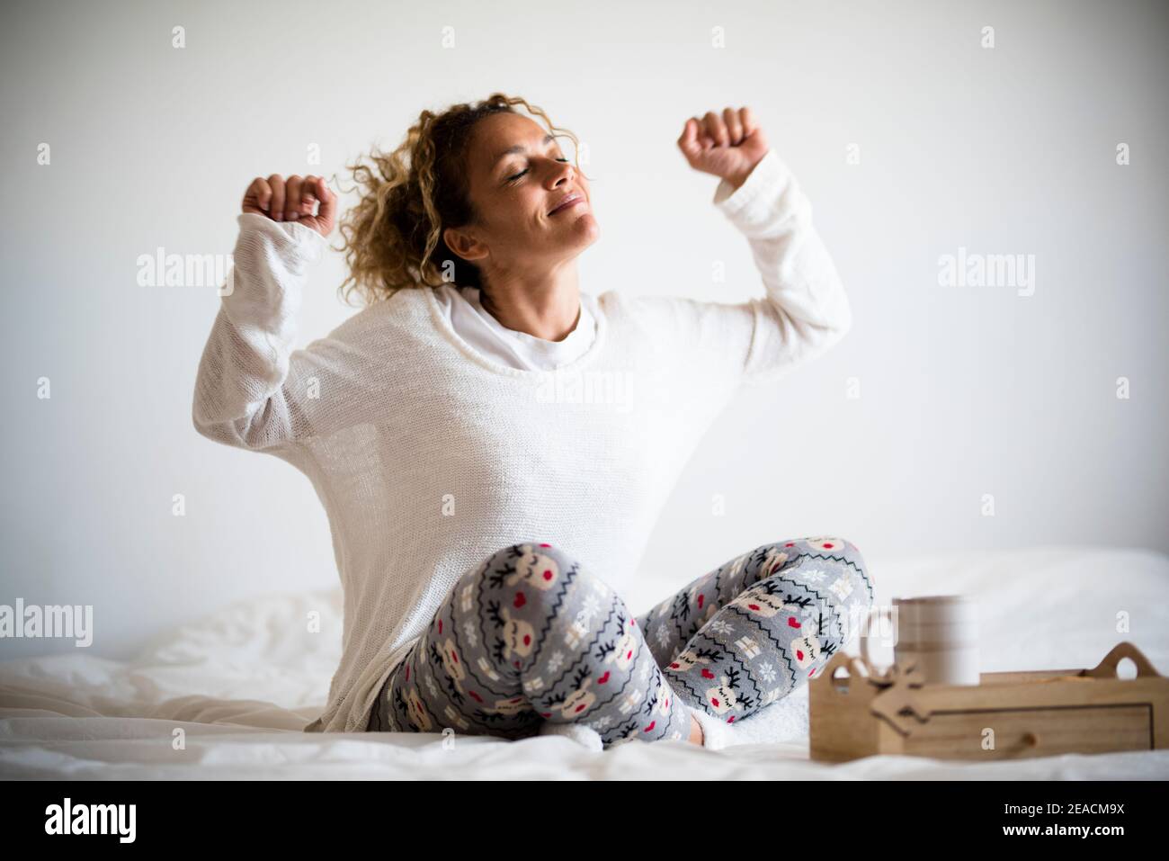 Happiness and good life concept with happy adult young woman wake up ...