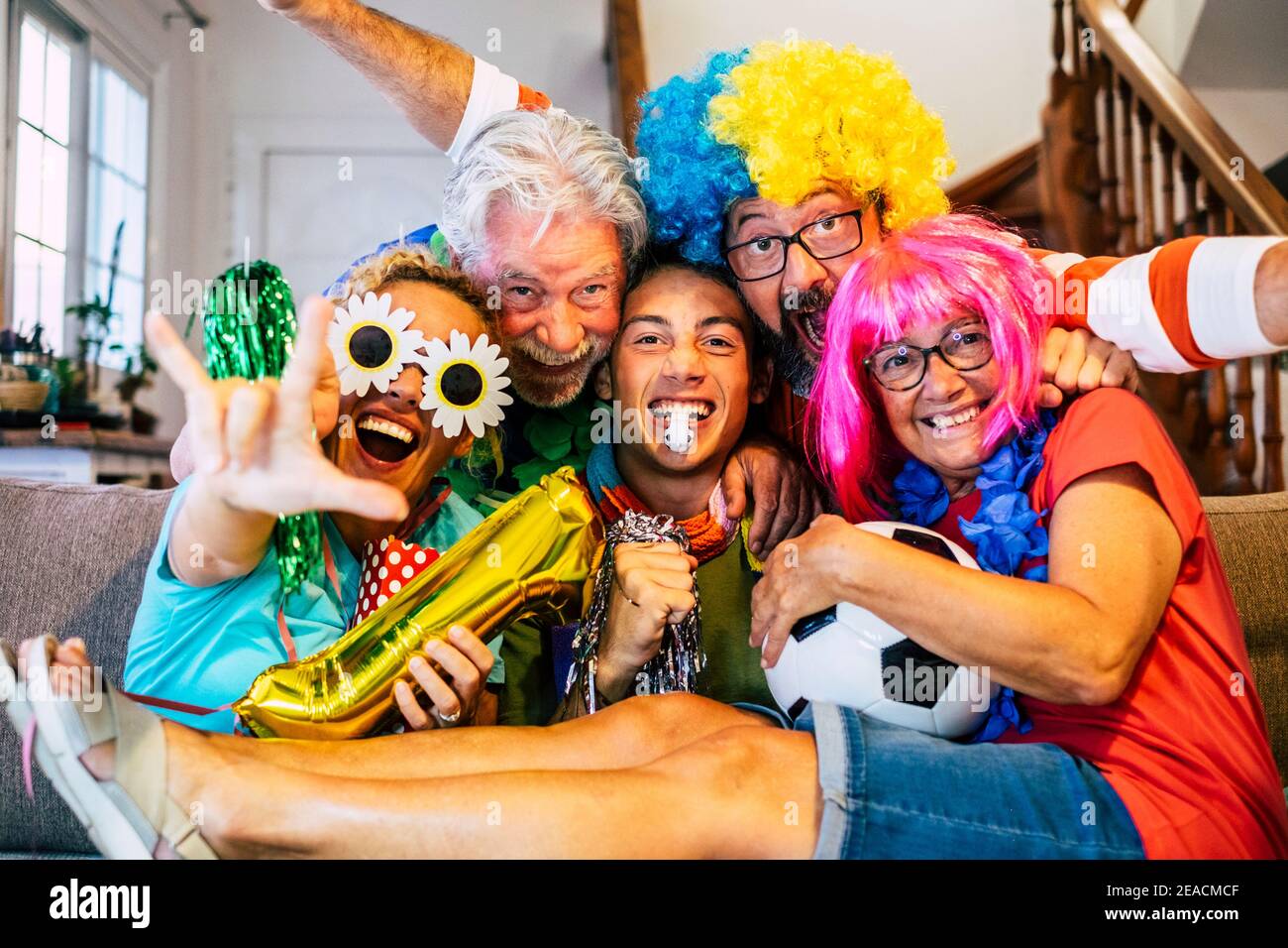 Group Of Crazy And Coloured Football Supporter Celebrate And Exult