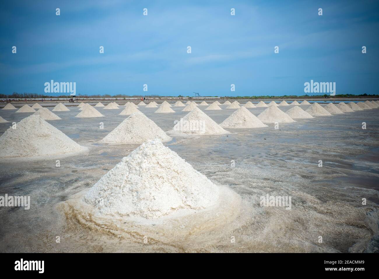Farming salt,sea salt pile pyramid,raw salt from natural,blue sky ...