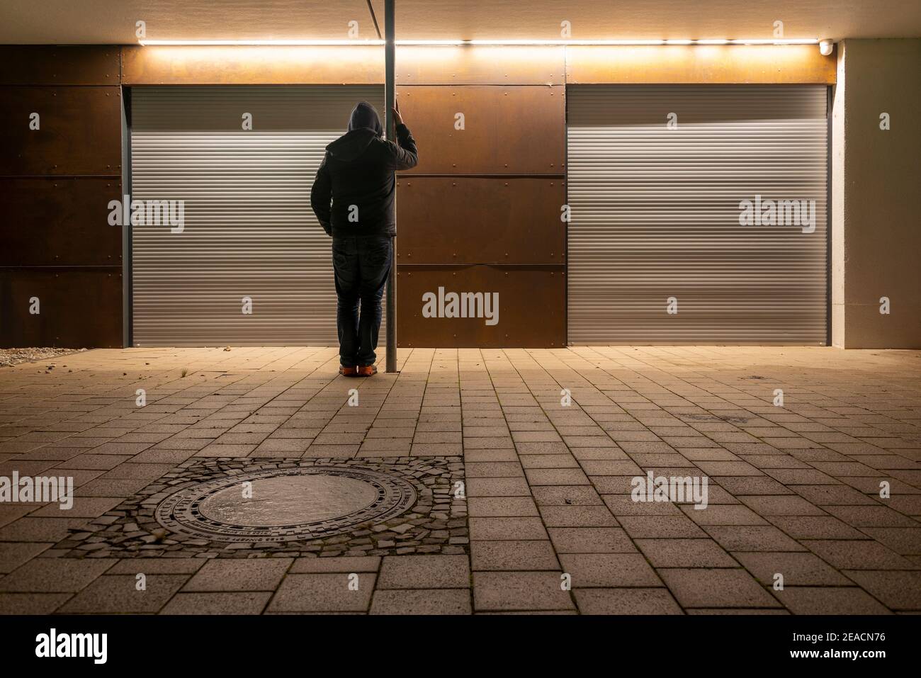 Man in front of locked shop on metal rod hi-res stock photography and ...