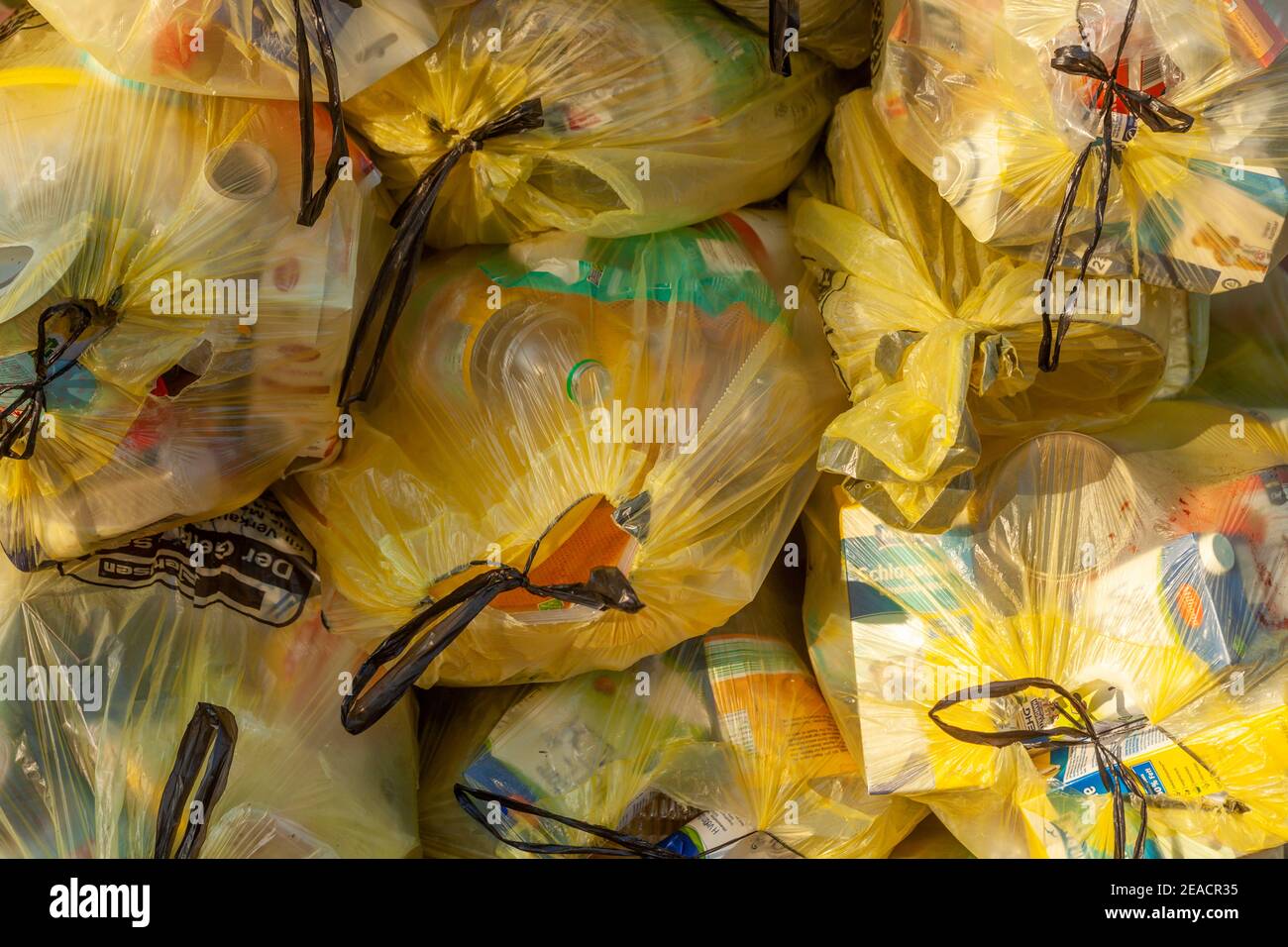 Stacked yellow sacks for plastic waste, waste separation, Lower Saxony ...