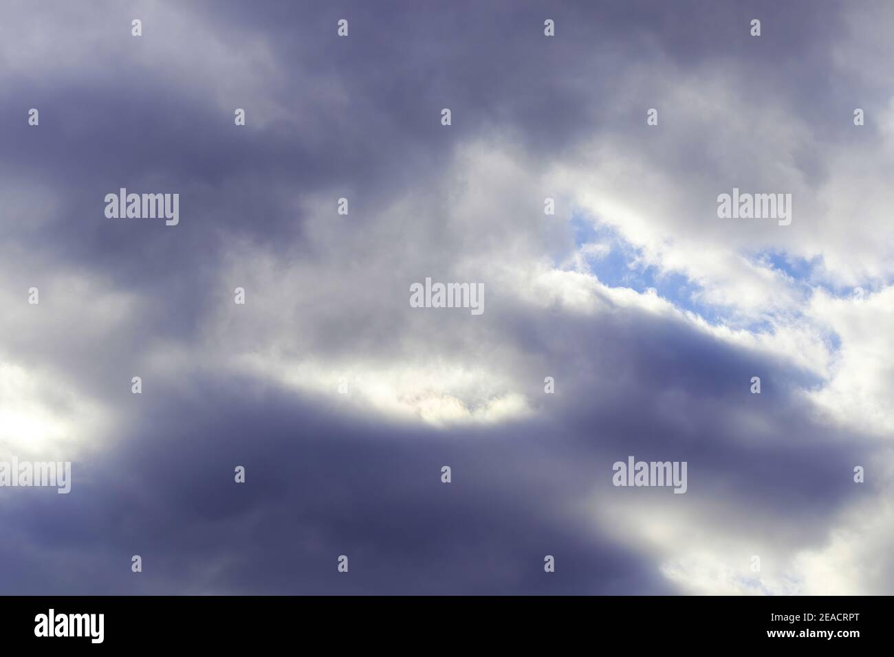 Dark, grey and white clouds gather overhead, to form the beginning of a ...