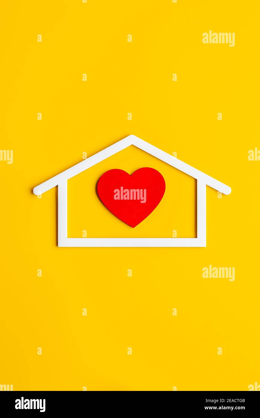 House shape with heart. Love family concept Stock Photo - Alamy