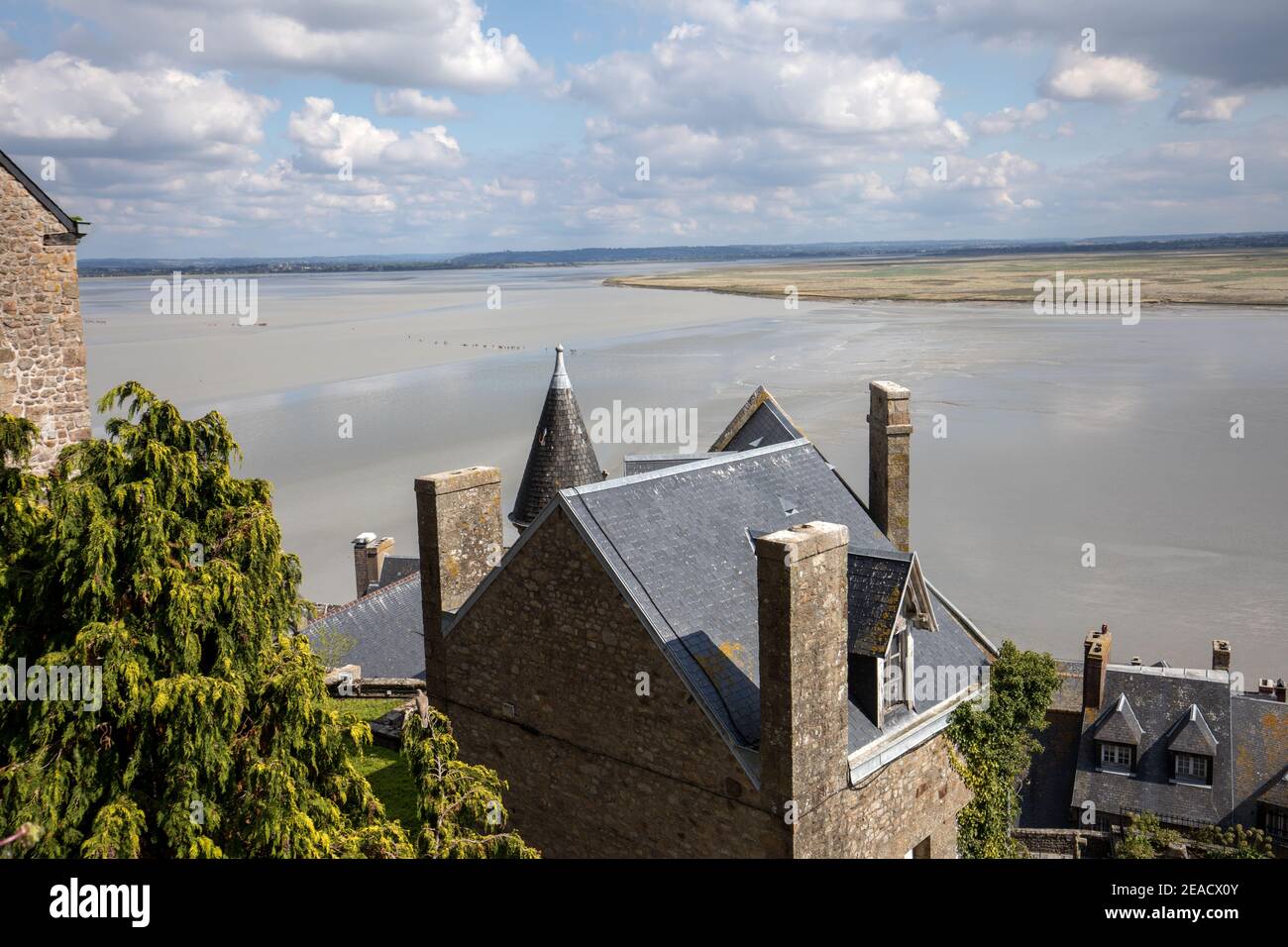 Mont Saint-Michel, the monastery and village on a tidal island between ...