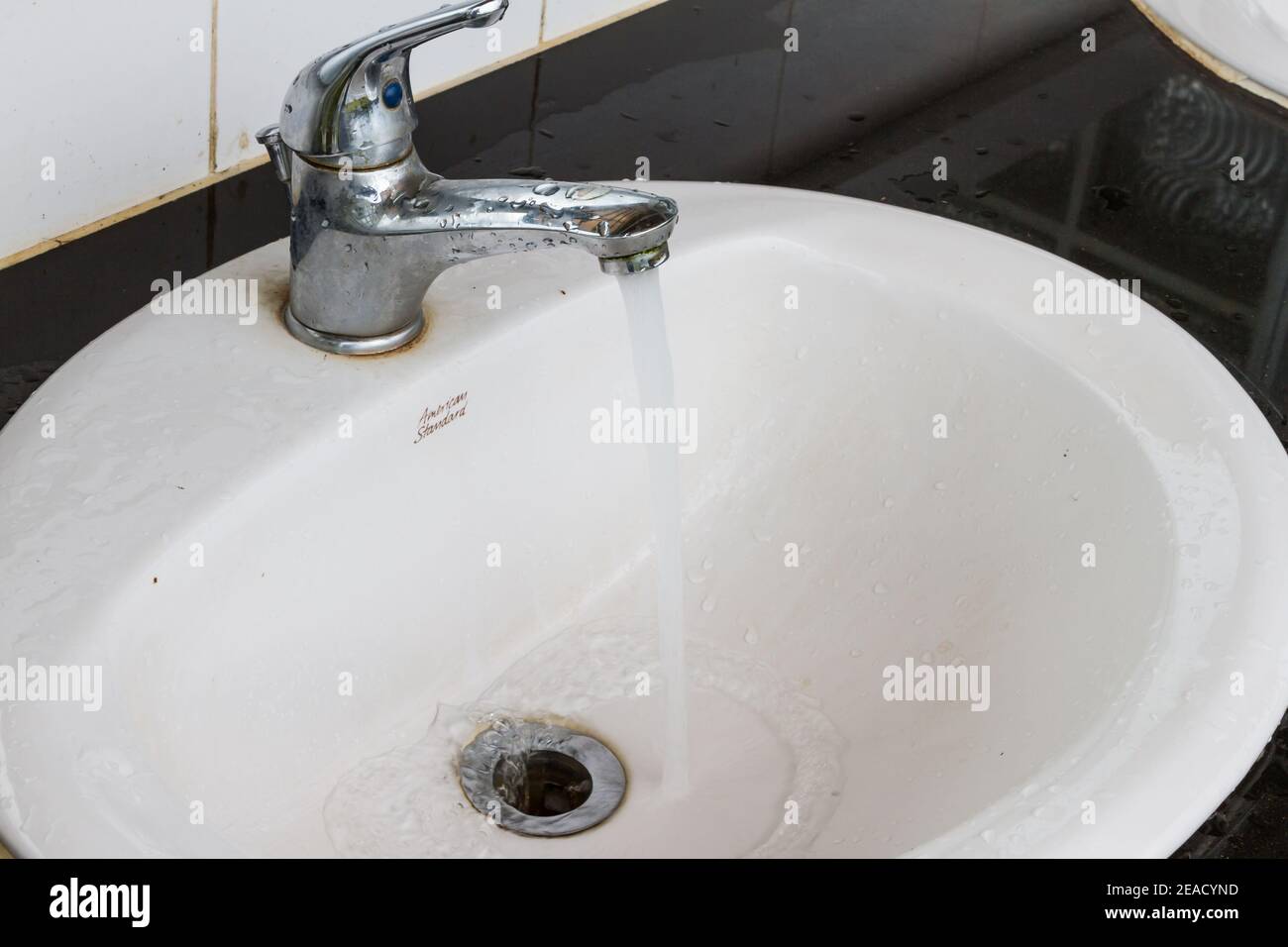 Dirty Washing hands in a public restroom, public sinks Stock Photo - Alamy