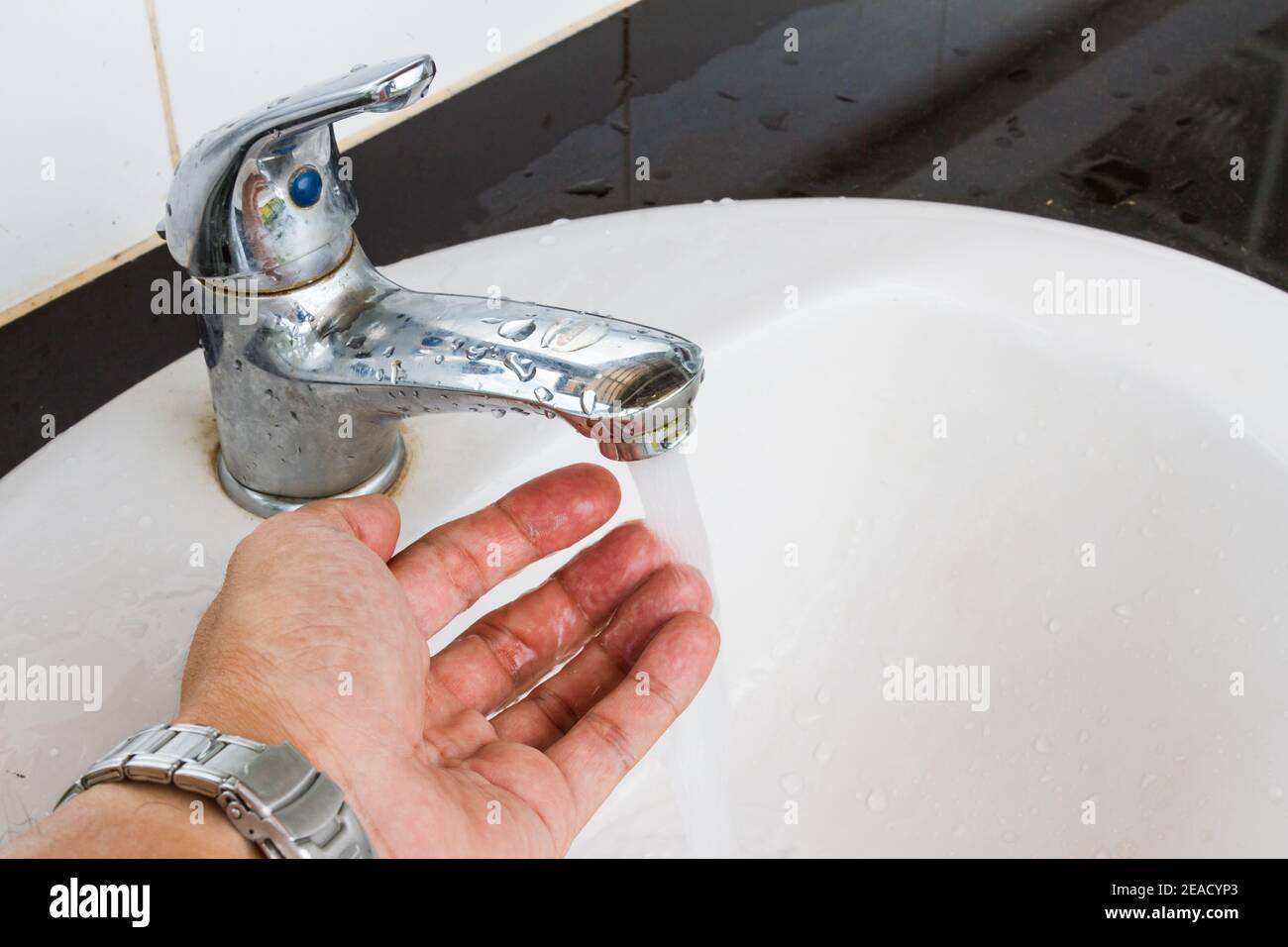 Washing hands in a public restroom, public sinks Stock Photo - Alamy