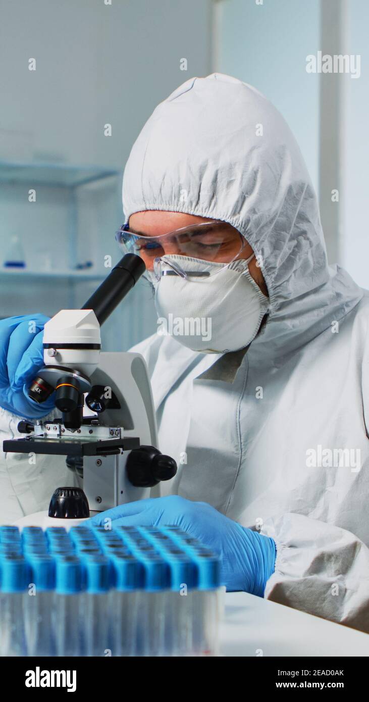 Medical research scientist in ppe suit conducting vaccine development ...