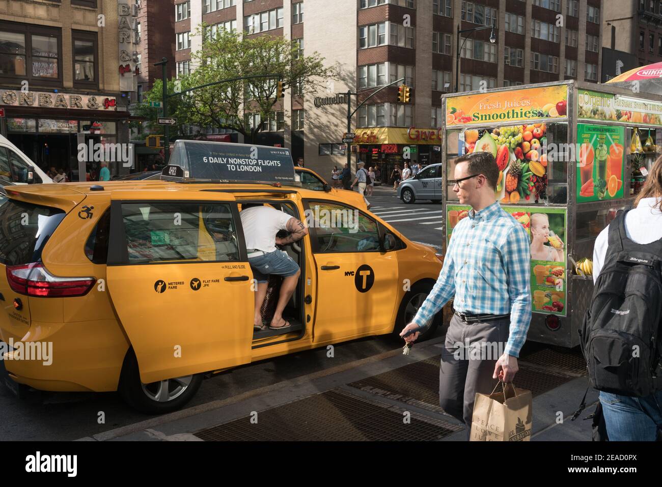 Man getting into NYC taxi Stock Photo - Alamy