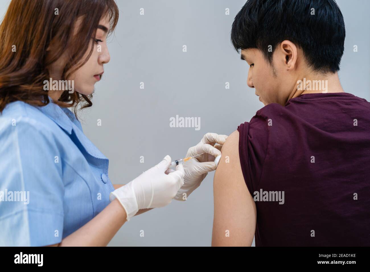 doctor holding syringe and using a cotton before make injection to ...