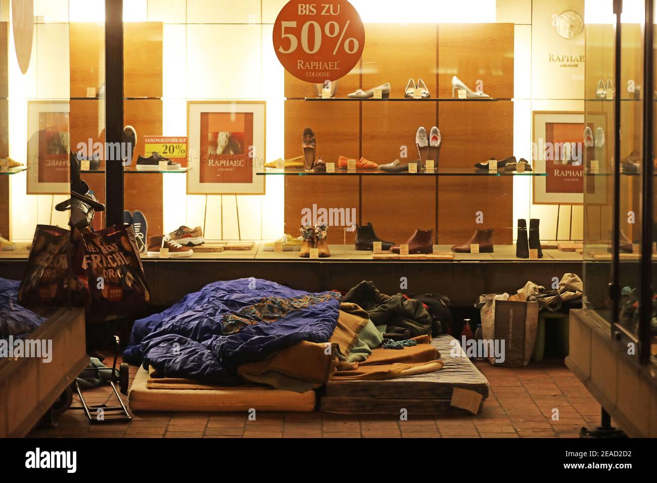 Cologne, Germany. 09th Feb, 2021. A homeless person sleeps in front of ...