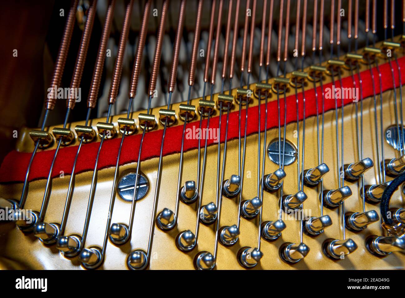 A close-up of the internal string structure of a top grand piano Stock ...