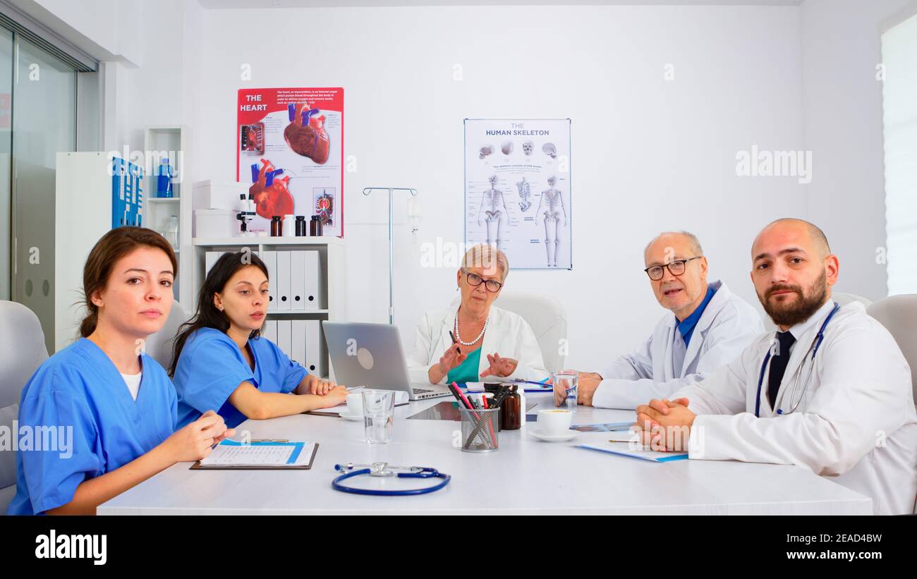 Group of specialist doctors having video meeting, discussing on webcam ...