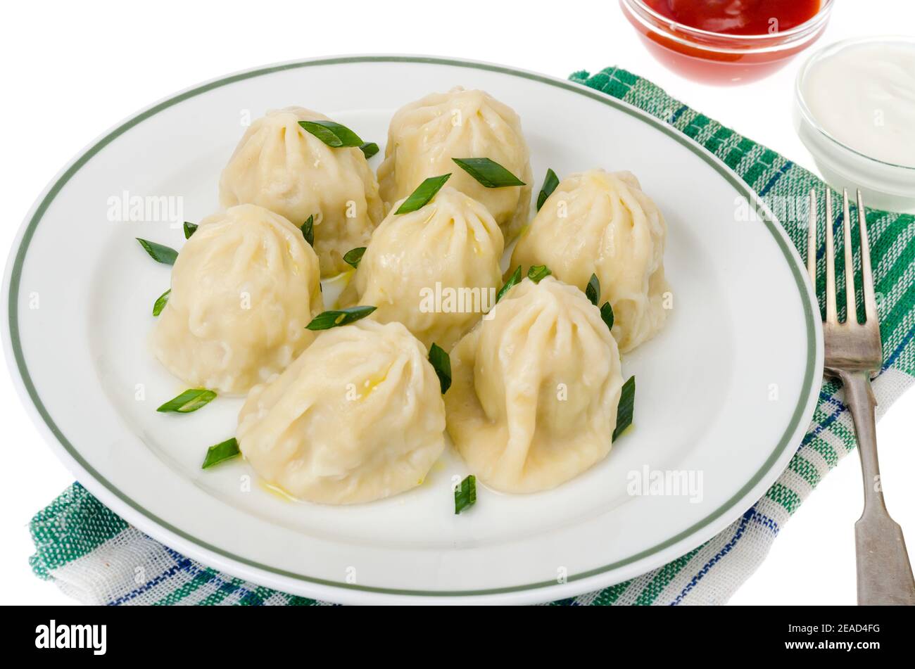 Boiled hot khinkali with meat, spices and ketchup. Studio Photo Stock ...