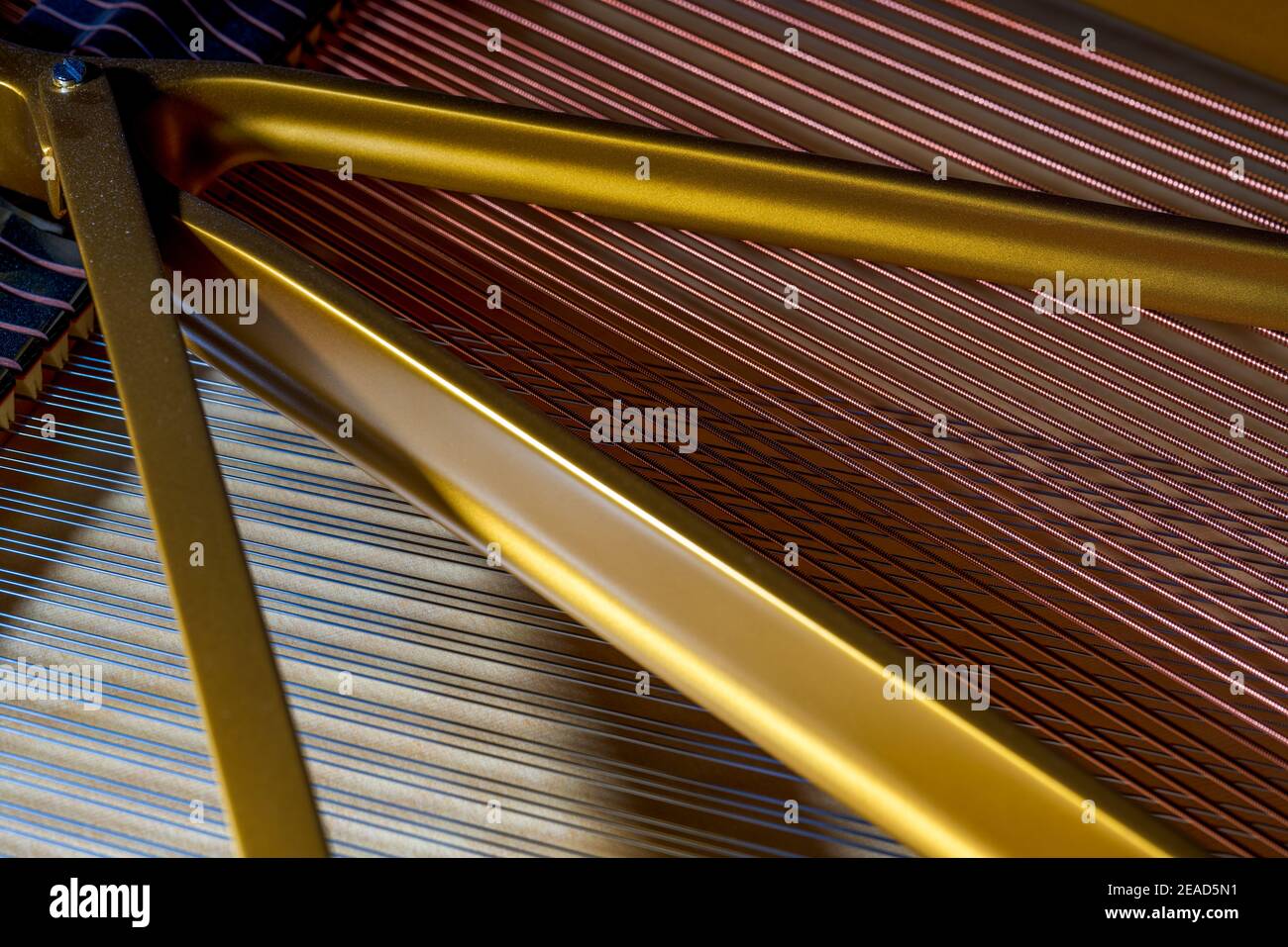 A close-up of the internal string structure of a top grand piano Stock ...