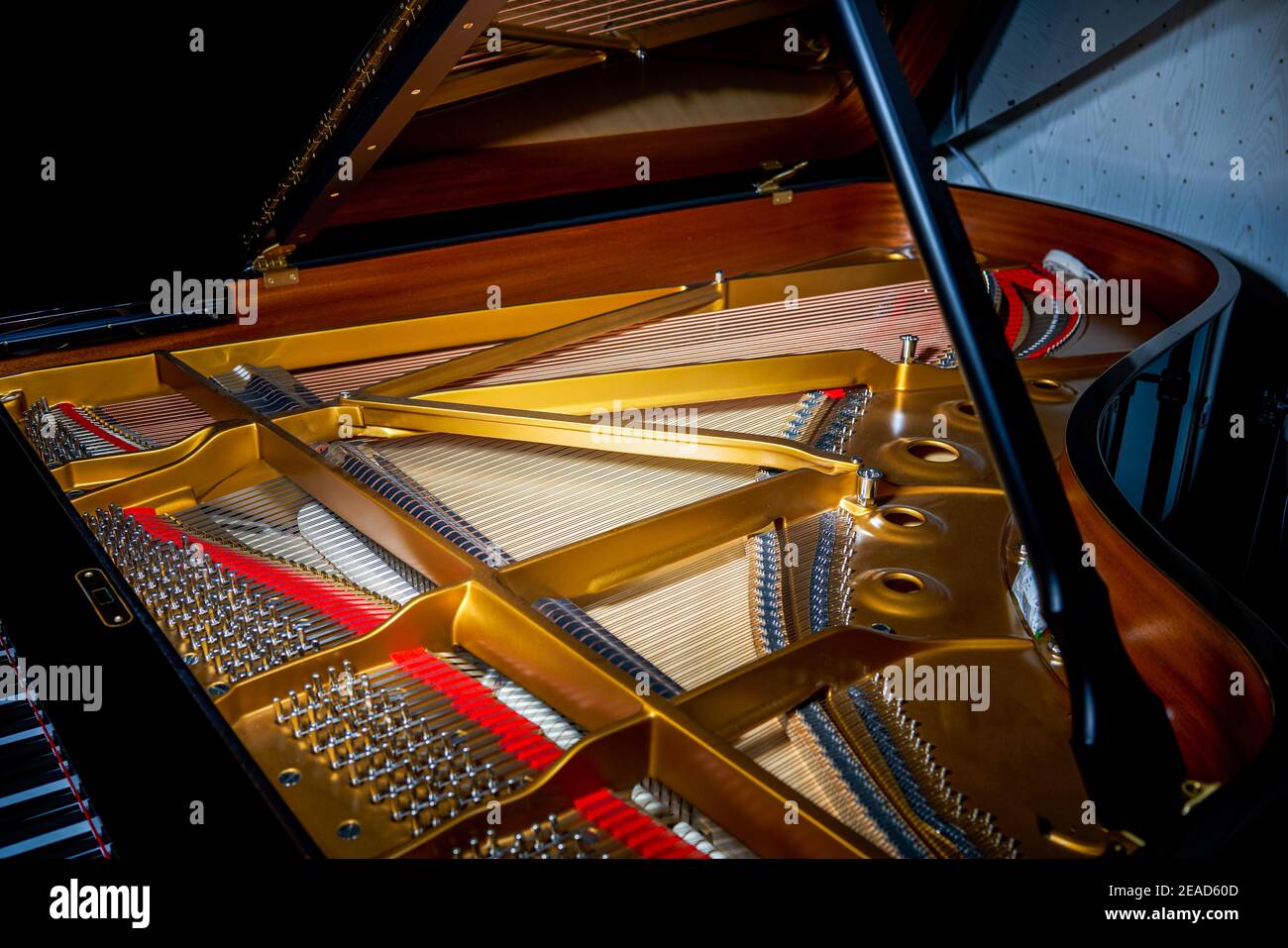 A close-up of the internal string structure of a top grand piano Stock ...