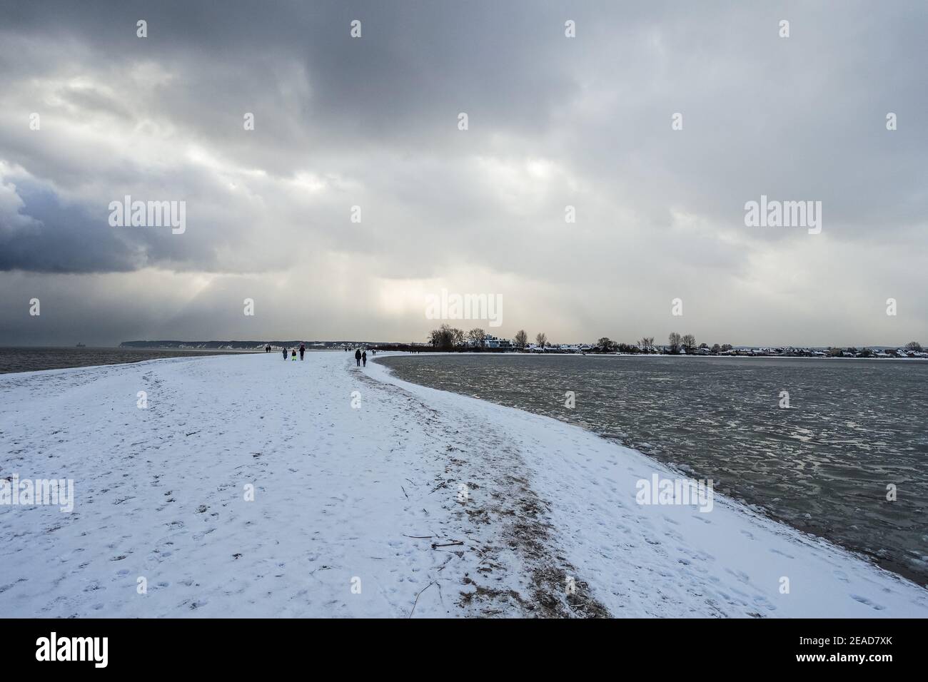 Rewa, Poland 6th, Feb. 2021 People walking by the Baltic sea coast ...