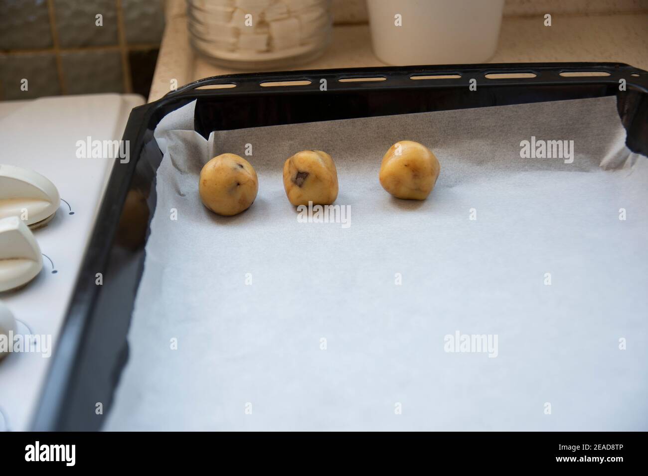 Ready to cook. round dough. Adult woman bakes delicious and crunchy ...