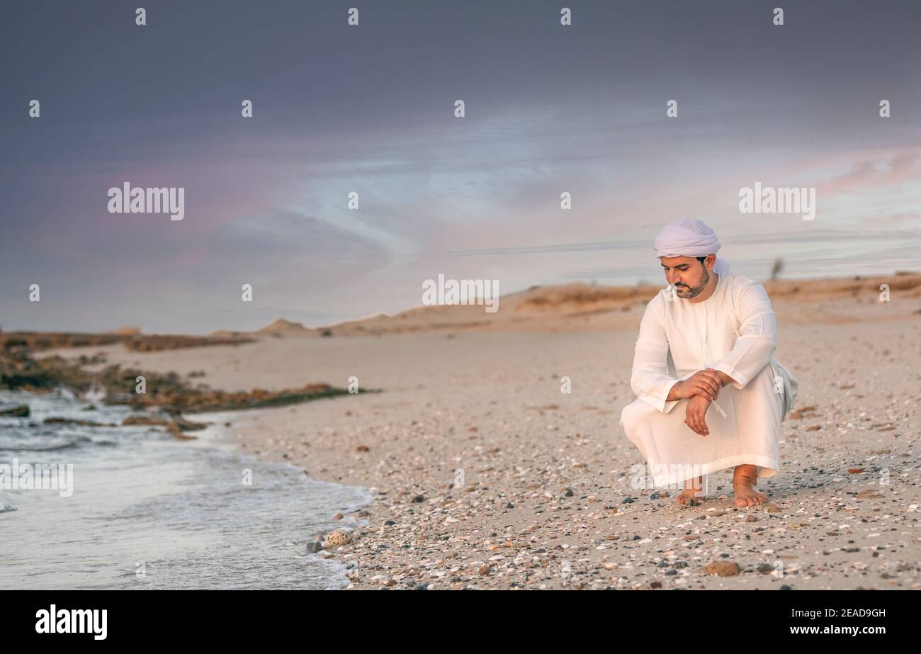 emirati man at a beach in UAE Stock Photo - Alamy