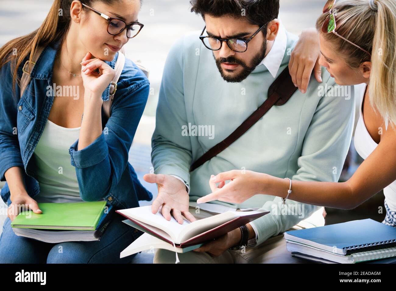 College students studying on university campus outdoor Stock Photo - Alamy