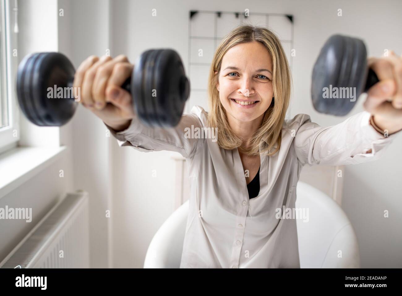 Work Life Balance: Business woman working and doing sport in her office ...