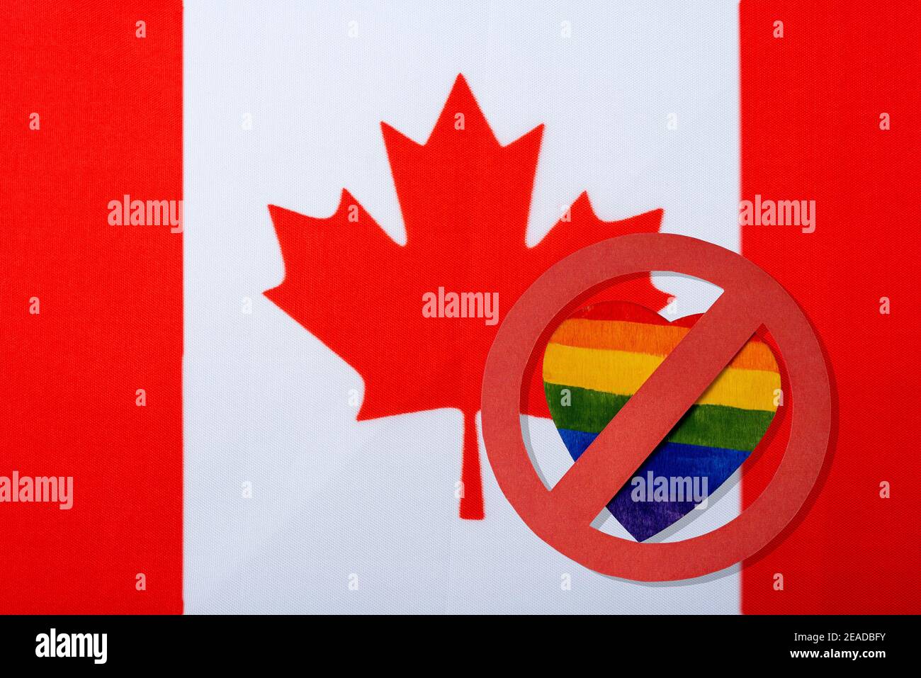 The Canadian flag and the LGBT ban. The red circle of the heart in the ...