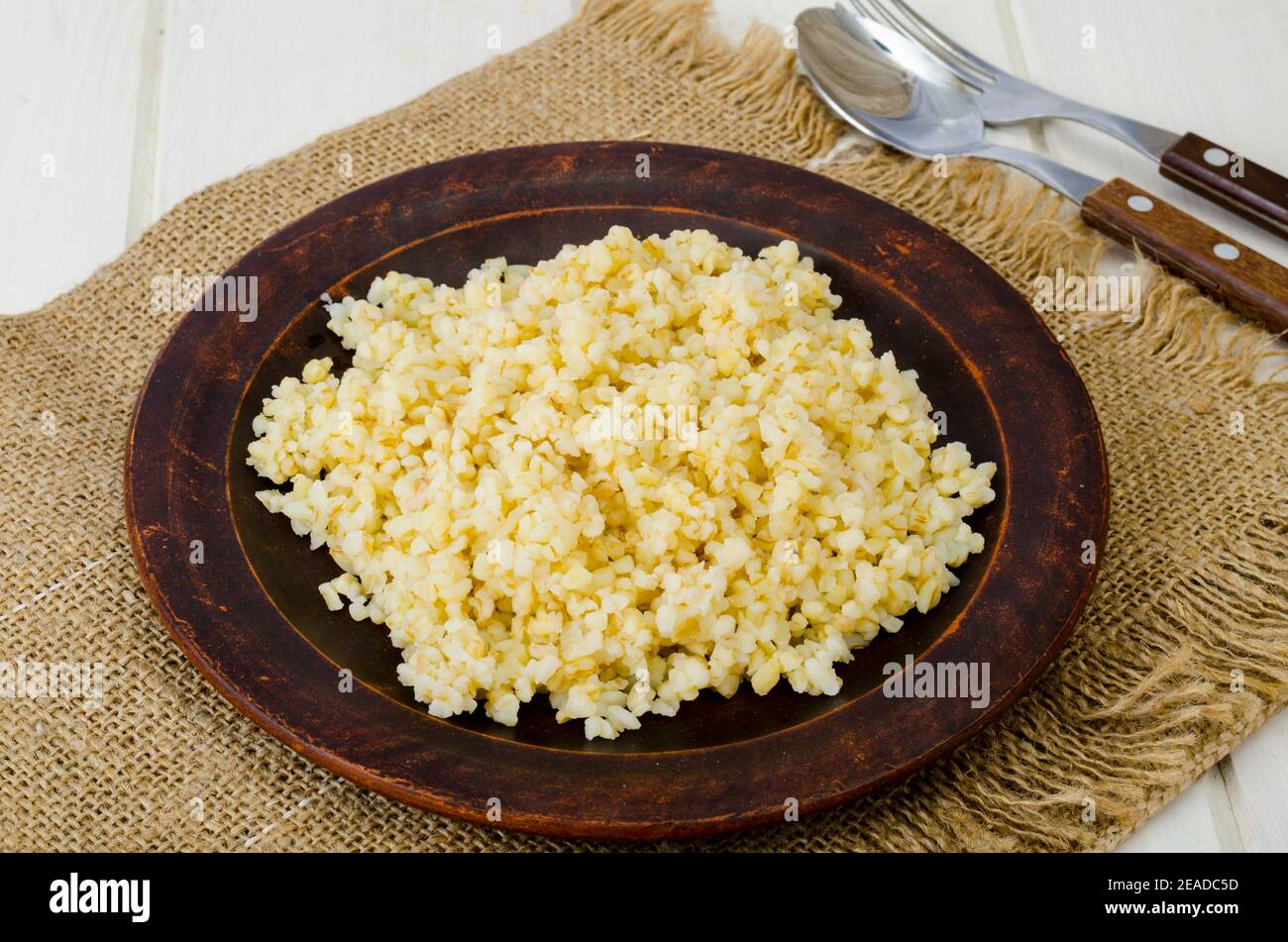 Boiled bulgur groats, vegetarian porridge. Studio Photo Stock Photo - Alamy