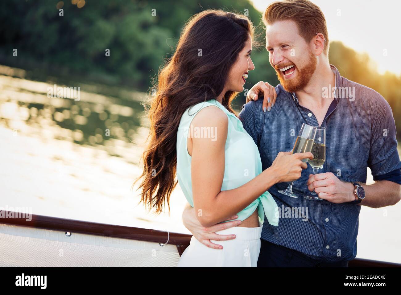 Happy smiling couple in love dancing and flirting Stock Photo - Alamy