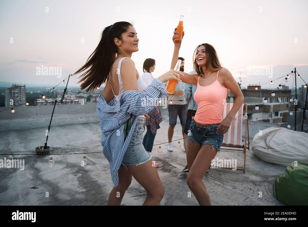 Group of happy young people friends dancing and having fun in party ...