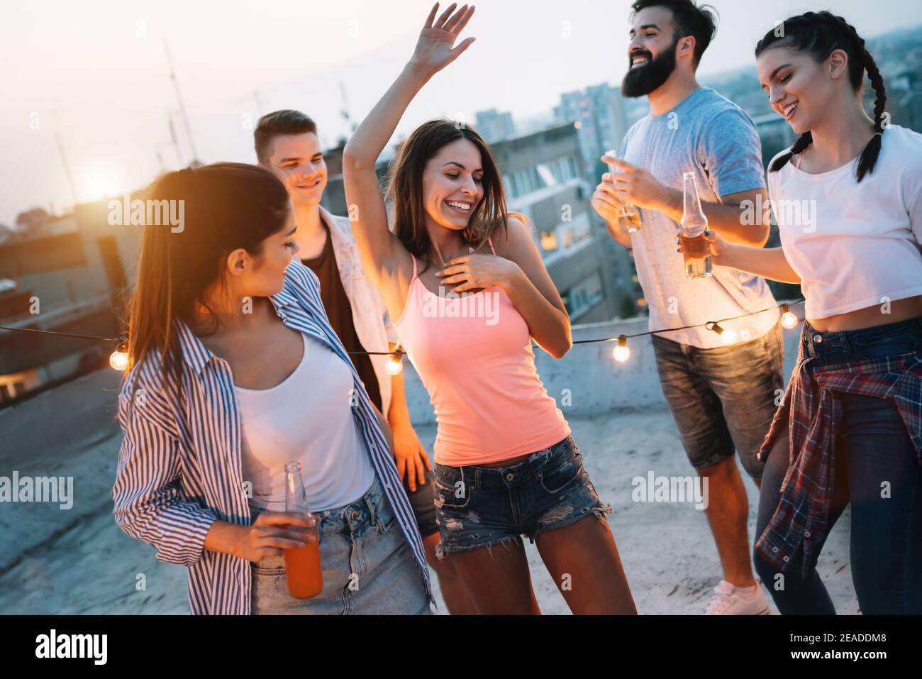 Group of happy young people friends dancing and having fun in party ...