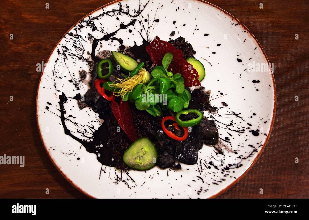 Ceviche seabass, with perfumed black rice on cuttlefish ink Stock Photo ...