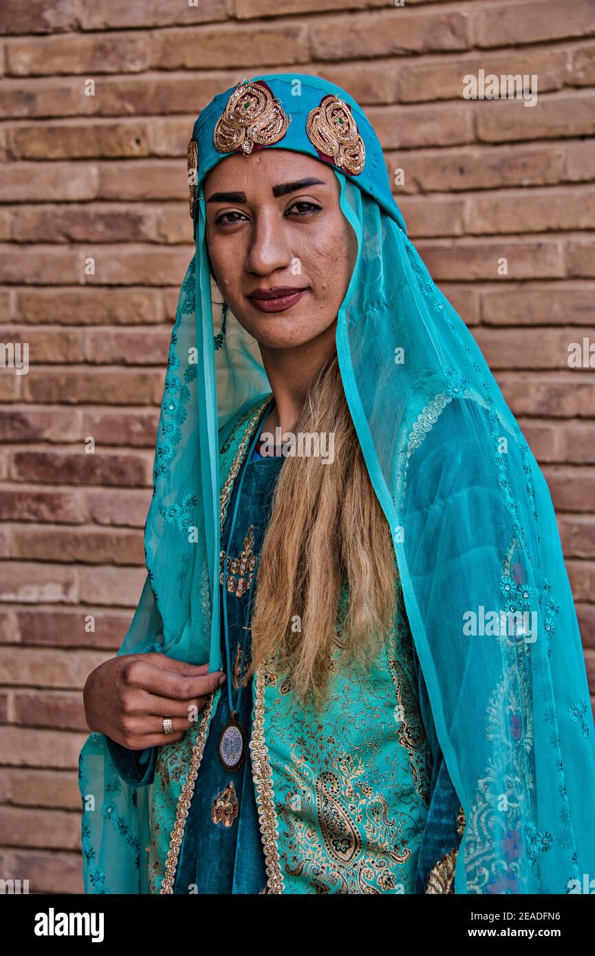 Young baloch woman in traditional clothing, Kerman bazaar, Kerman, Iran ...