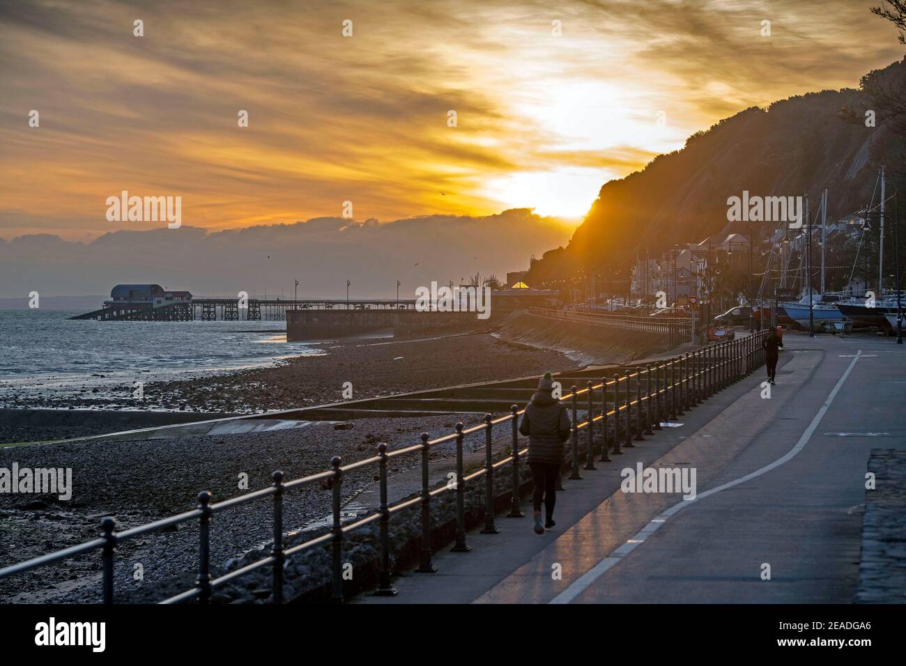 Swansea, UK. 09th Feb, 2021. Runners brave the cold weather brought by ...