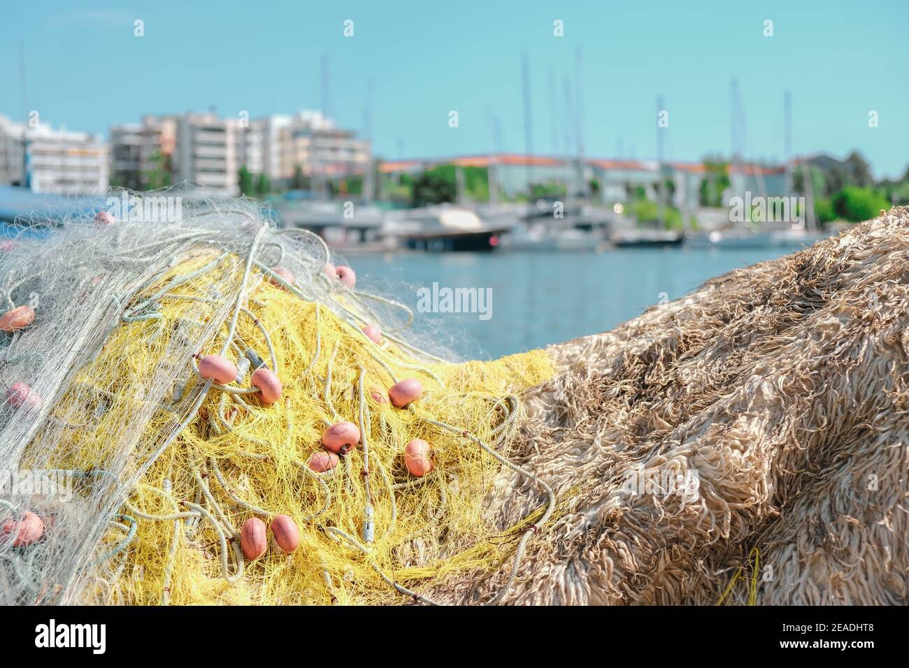 Colourful fishing nests piled up in the harbor on a greek island Stock ...