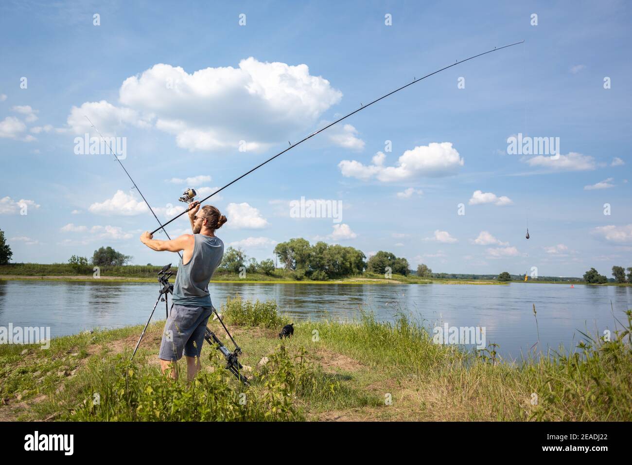 Man fishing on river bank hi-res stock photography and images - Alamy